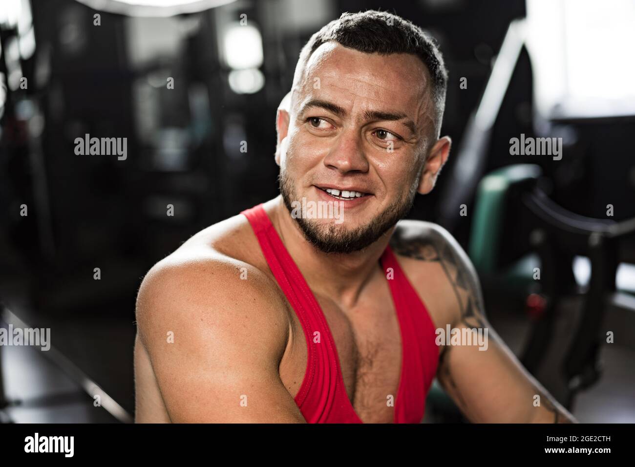 Portrait of man bodybuilder in red shirt in gym Stock Photo - Alamy