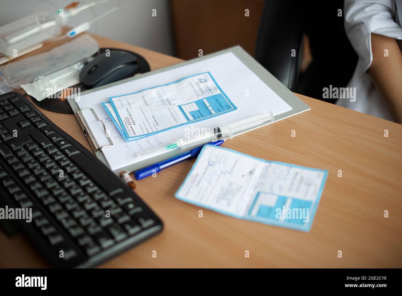 Top view table doctor work desk with computer keyboard,syringe, clip ...