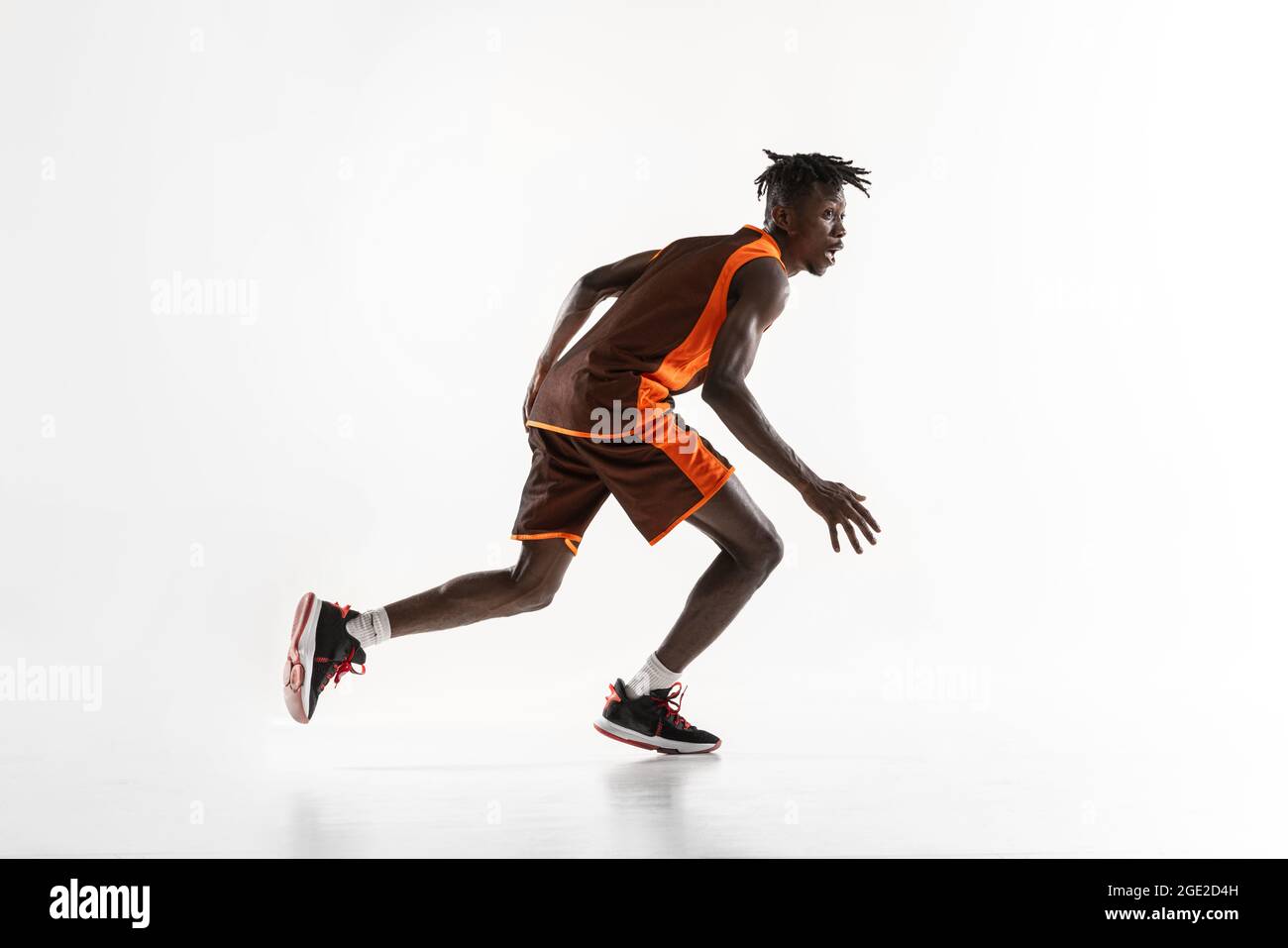 Young african man, professional athlete player running isolated over ...