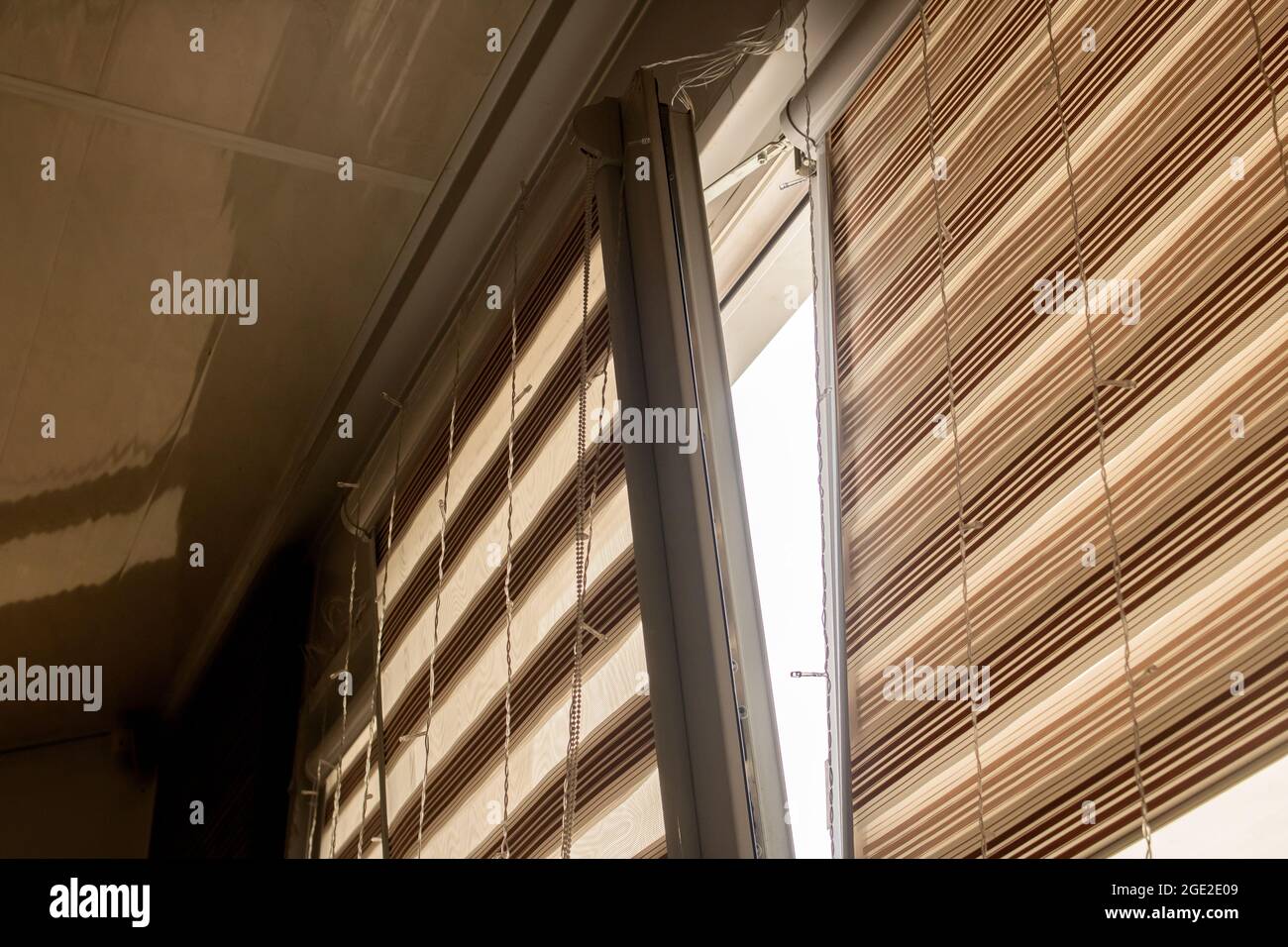 Wooden blinds on an open window close up Stock Photo - Alamy