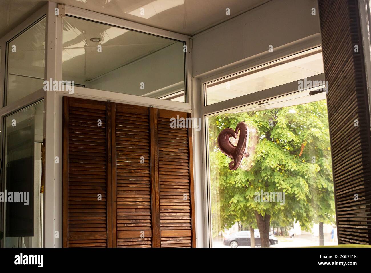 Wooden blinds on an open window close up Stock Photo - Alamy