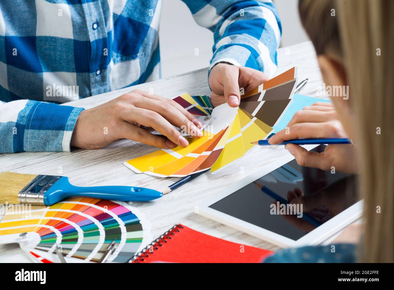 Interior designer choosing colors from swatches Stock Photo - Alamy