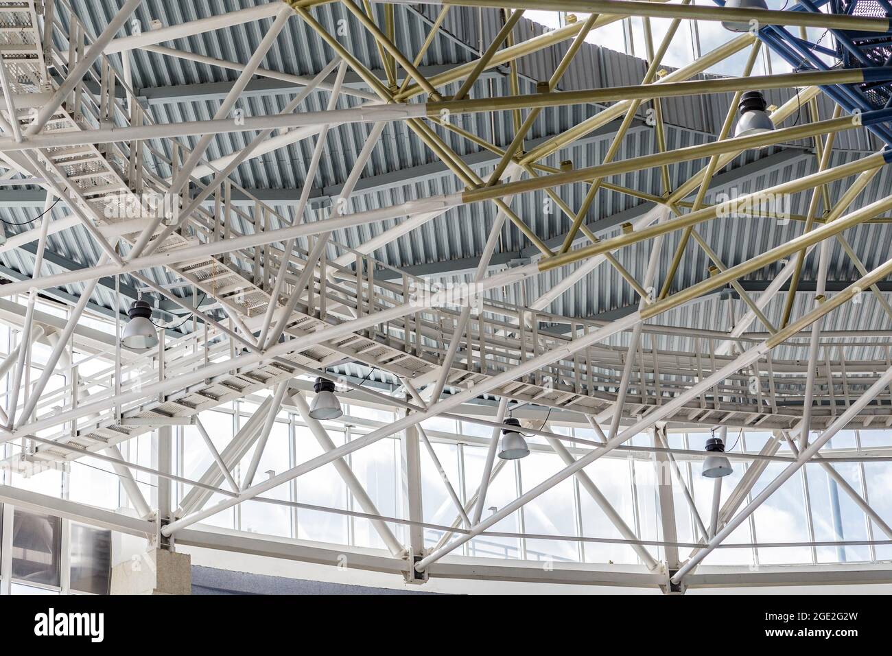 Metal tubes ceiling in big office building Stock Photo - Alamy