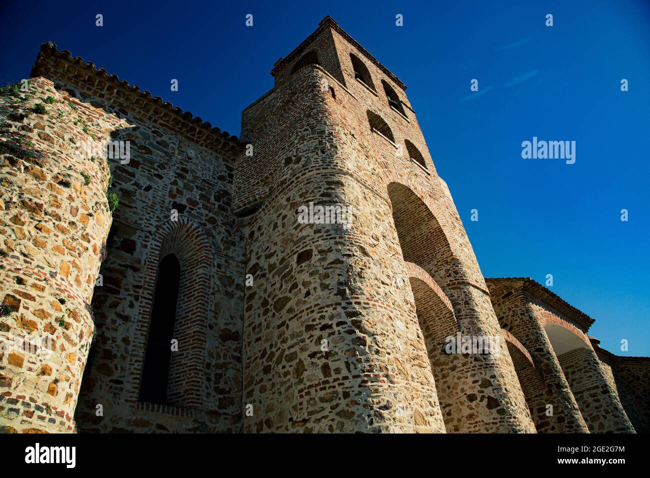 Facade of a Romanesque church with a large gate and facades with arches ...