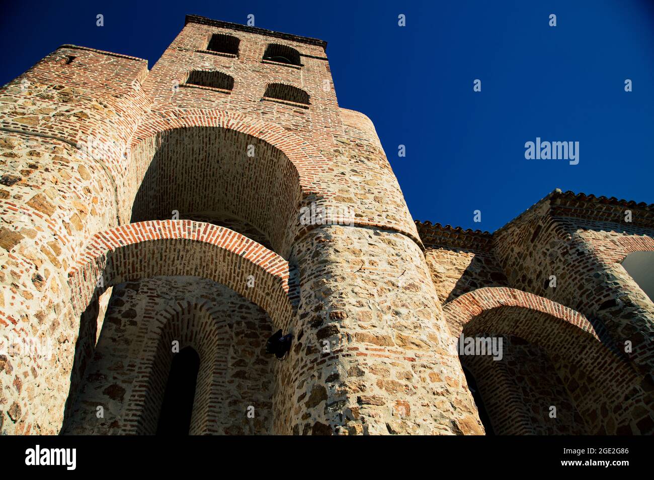 Facade of a Romanesque church with a large gate and facades with arches ...