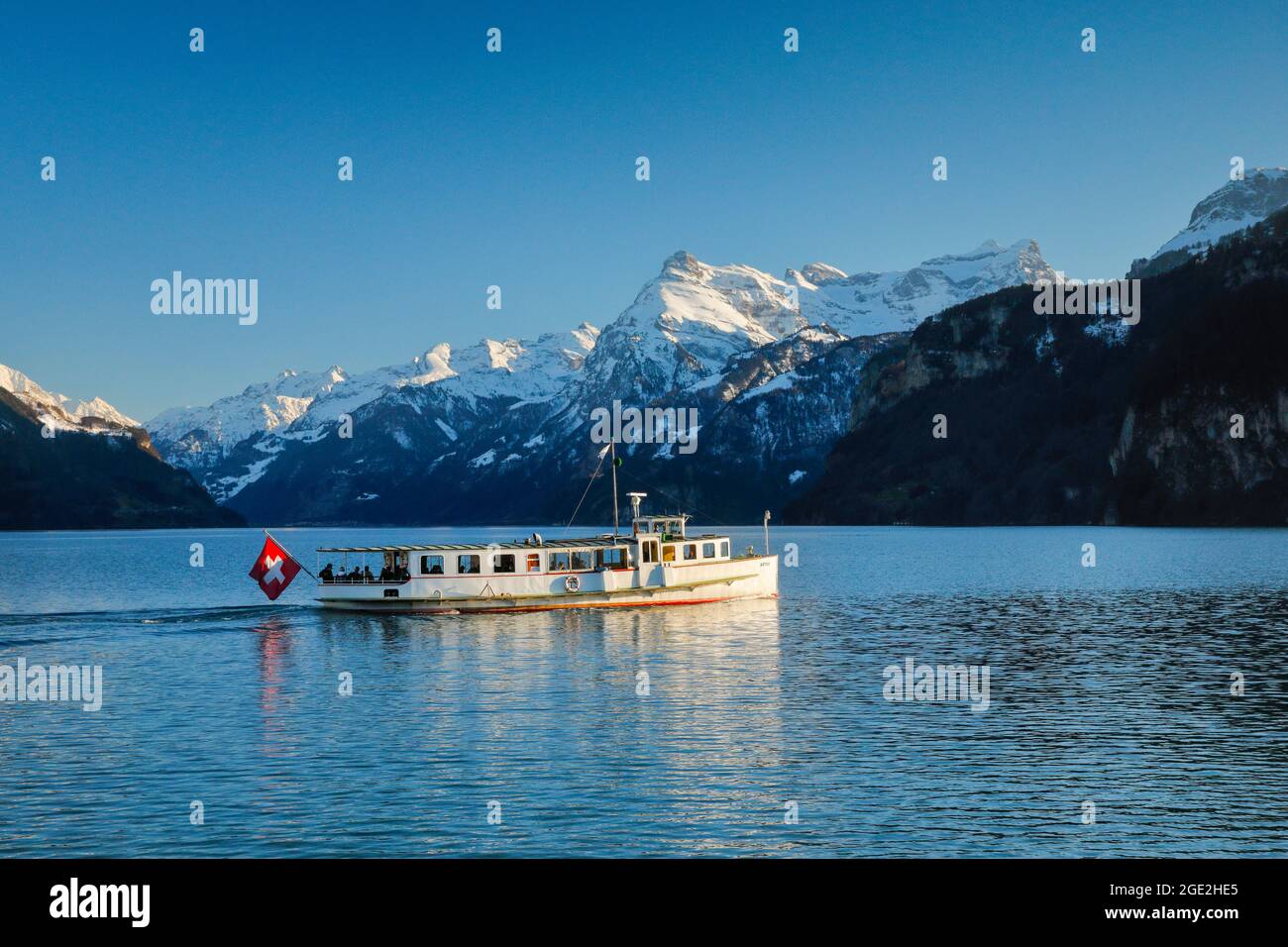View from Brunnen on a ferry boat on Lake Uri in front of the mountains ...