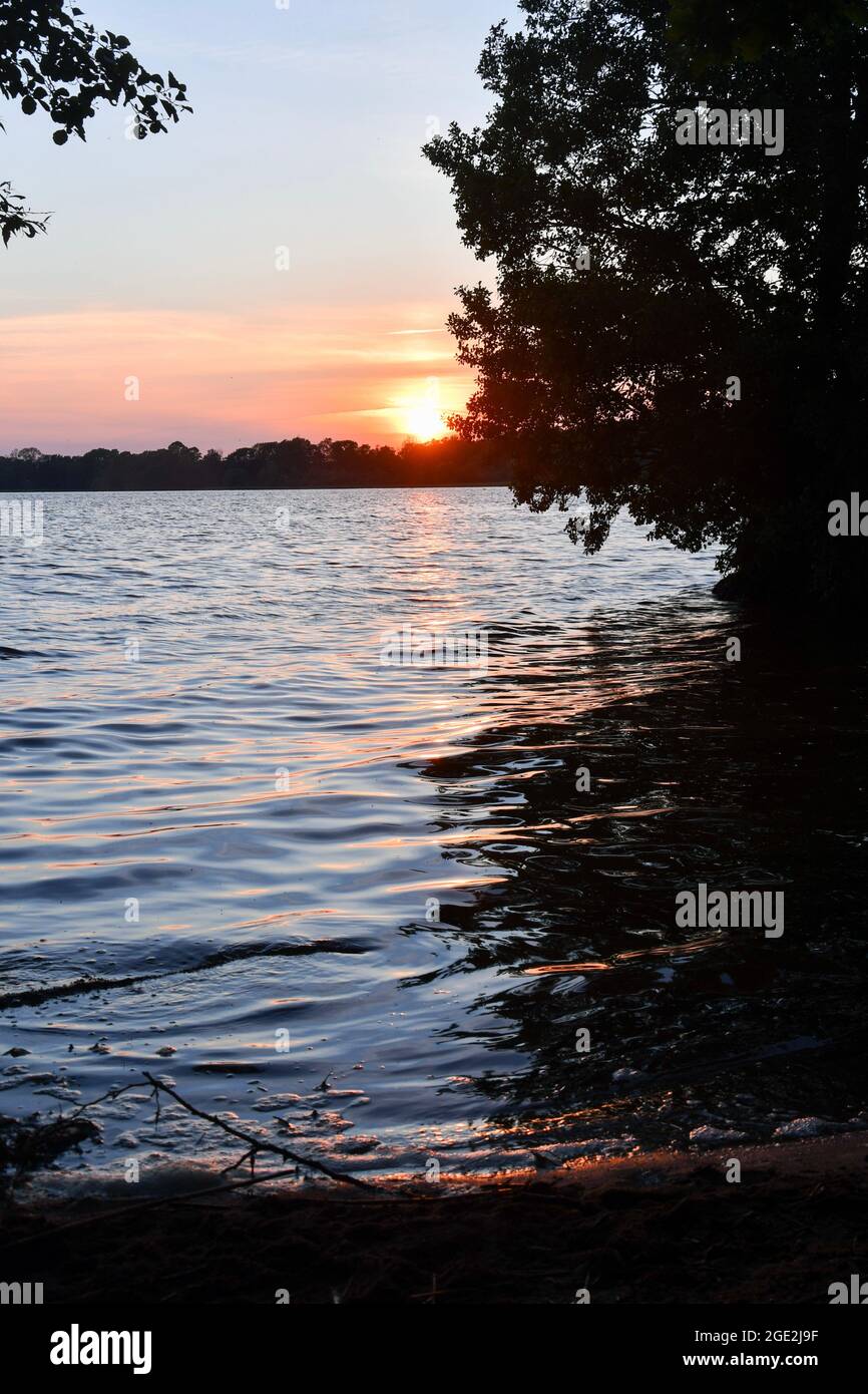 Landscape photo of sunset at a lake, background Stock Photo - Alamy