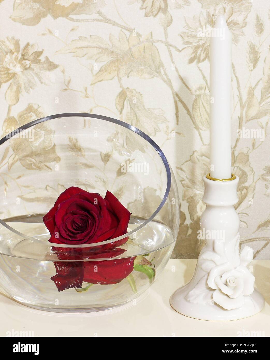 Red rose in water. Decorative vase Stock Photo - Alamy