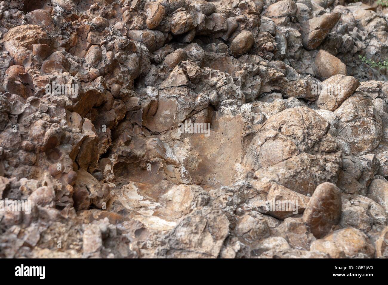 Background texture of rock with empty hollows from the fallen stones ...