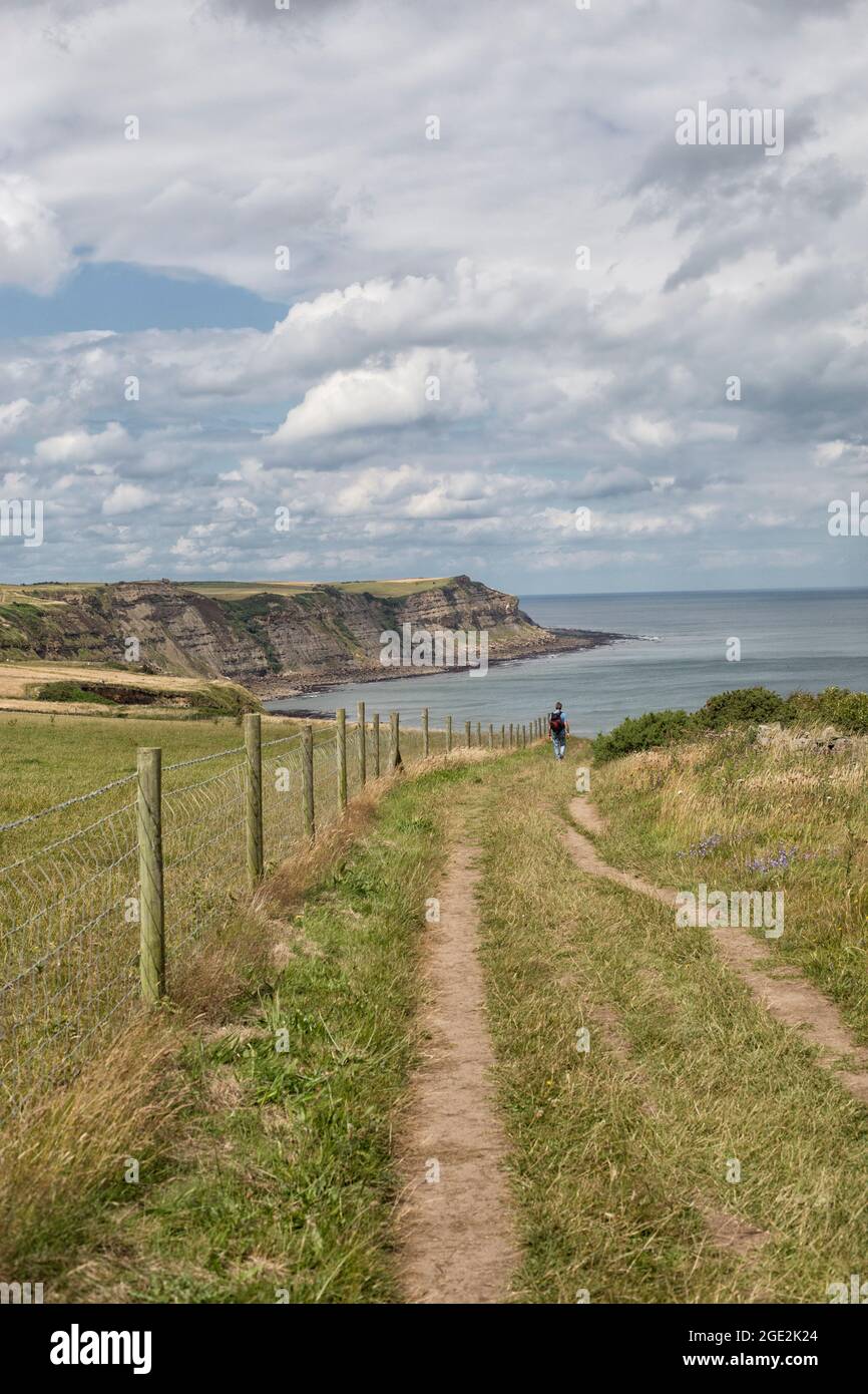 Man hiking on coastal path in north Yorkshire, England Stock Photo - Alamy