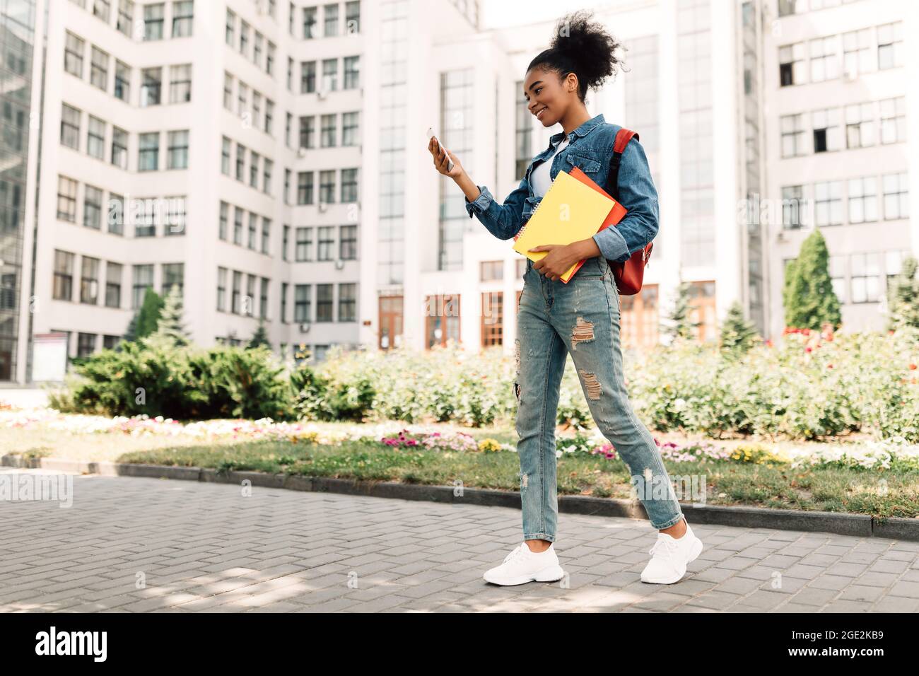 African American Student Girl Using Smartphone Browsing Internet Standing Outdoors Stock Photo ...