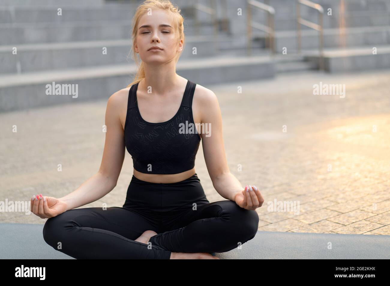 Yoga and Meditation in Modern City Caucasian Woman Relax Lotus Position ...