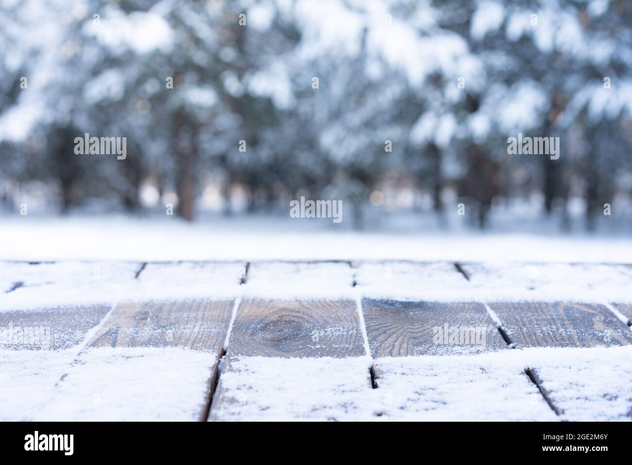 Beautiful winter scene. blurred background of snowy christmas nature background, Wood table top ...