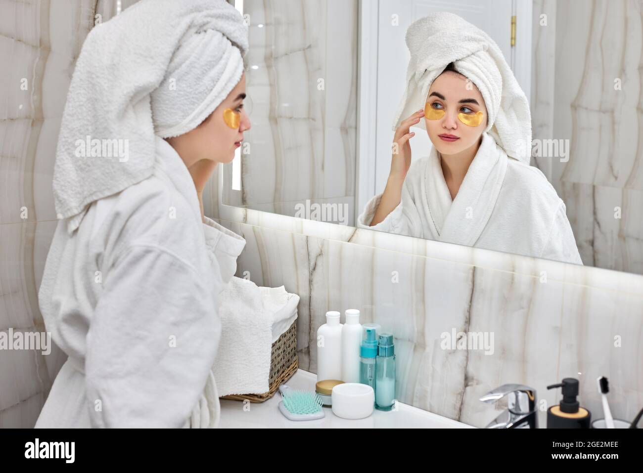 Beautiful Woman With Eye Patches In White Bathrobes In Bathroom Stock