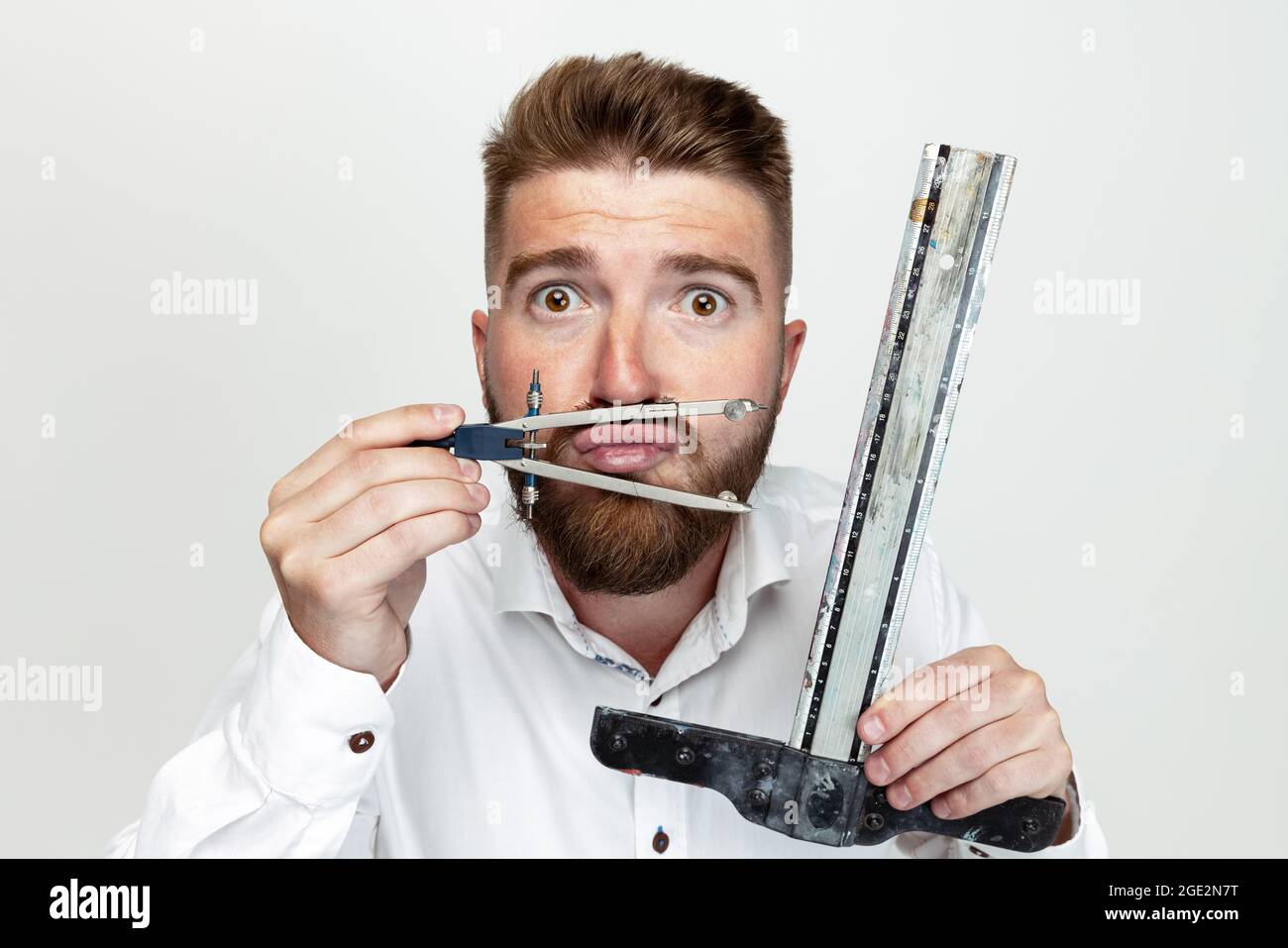 Portrait of funny bearded man, builder, designer or architect with ...