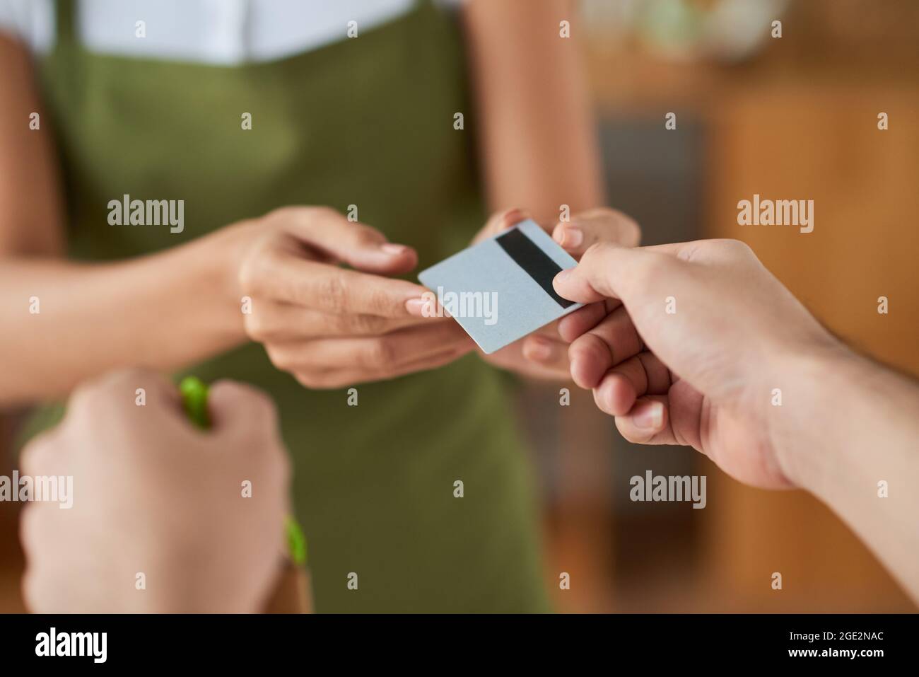 Female cashier giving money hi-res stock photography and images - Alamy