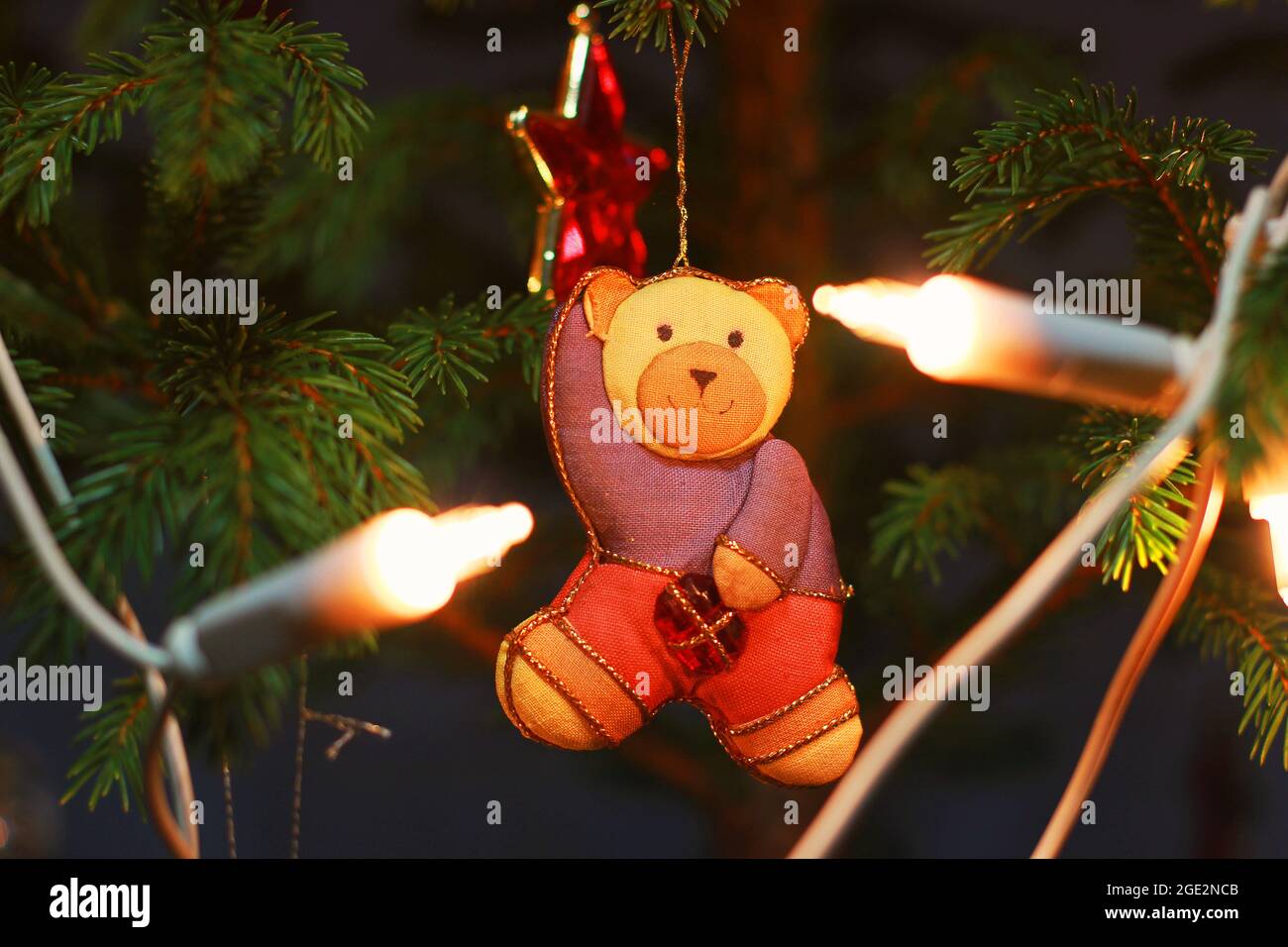 Christmas toy close up on a Christmas tree. Teddy bear toy Stock Photo ...