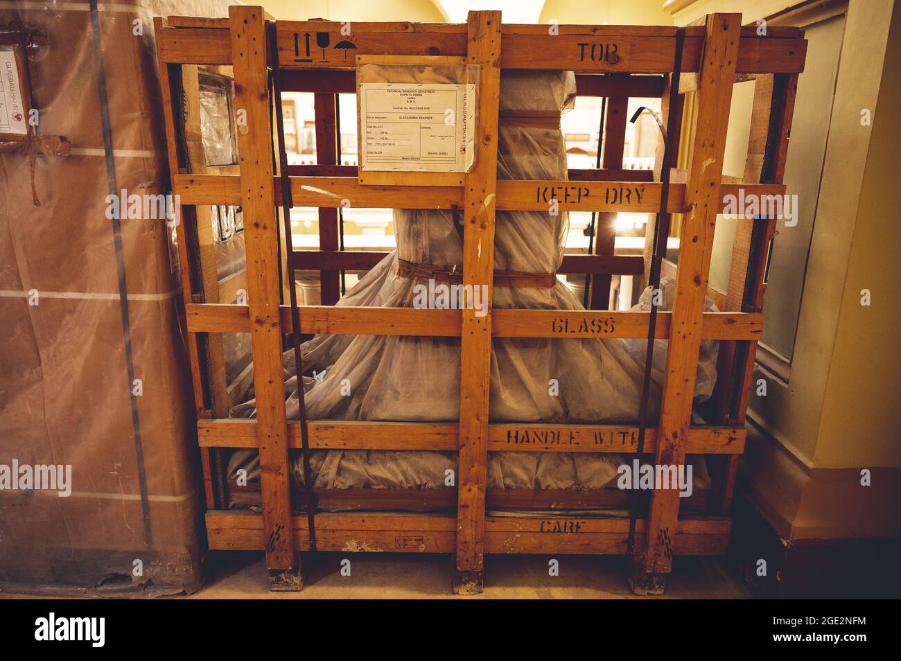CAIRO, EGYPT - Jun 06, 2021: A wooden crate with an ancient relic ...