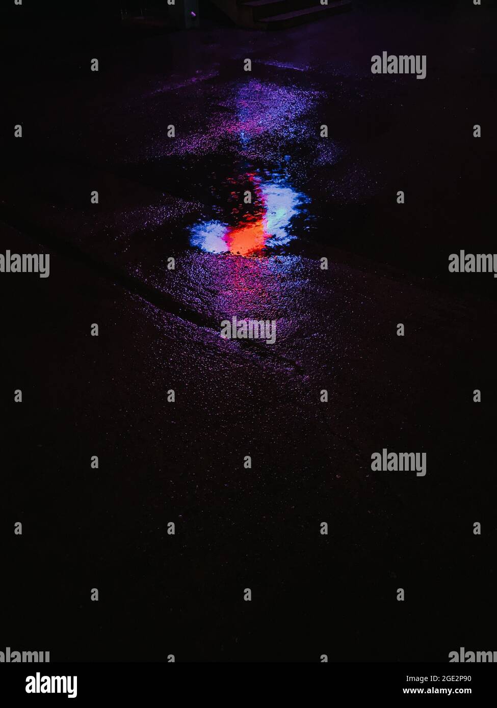 Neon sign reflecting in puddle hi-res stock photography and images - Alamy