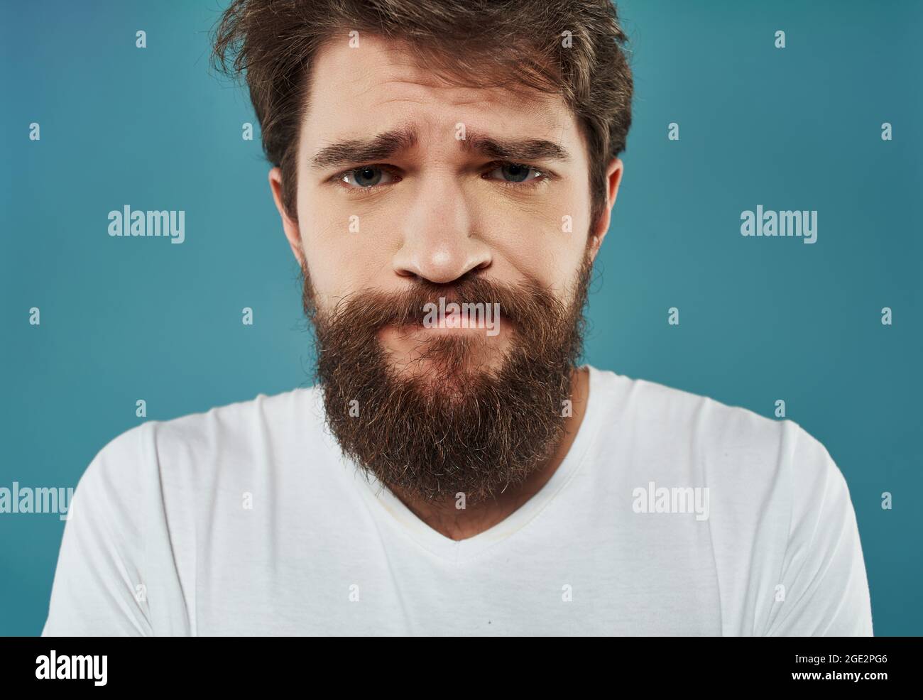 emotional man in a white t-shirt hand gestures anger Studio Stock Photo ...