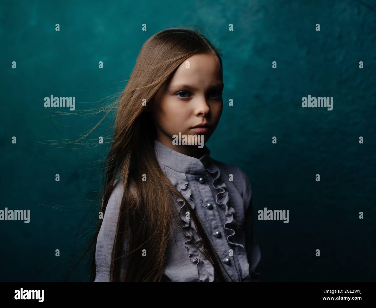 cute little girl in dress posing sad look Stock Photo - Alamy