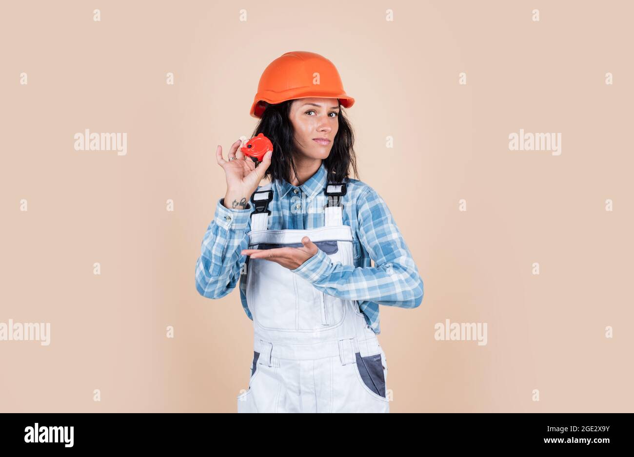 Think differently. architect working with tape measure. female foreman ...