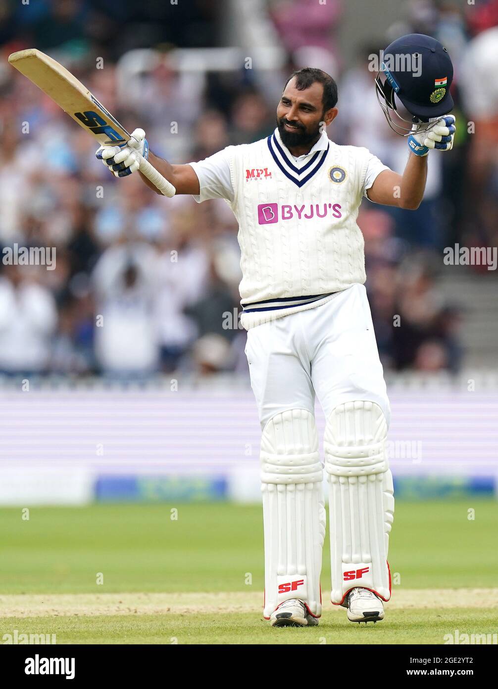 India's Mohammed Shami celebrates hitting a half century during day ...