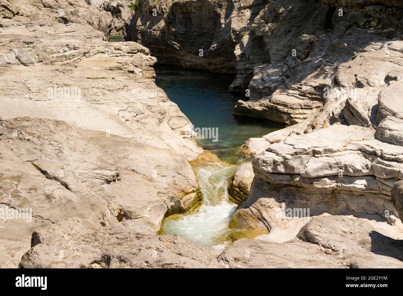 Quiet turquoise river stream along the tectonic rocks Stock Photo - Alamy