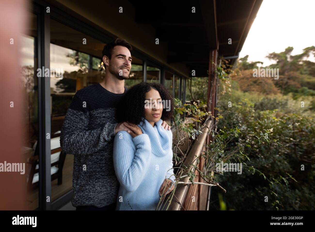 Couple sitting on balcony hi-res stock photography and images - Alamy