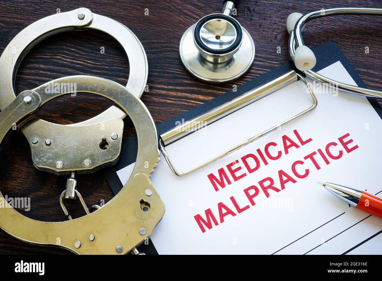 Medical malpractice form with stethoscope and handcuffs Stock Photo - Alamy