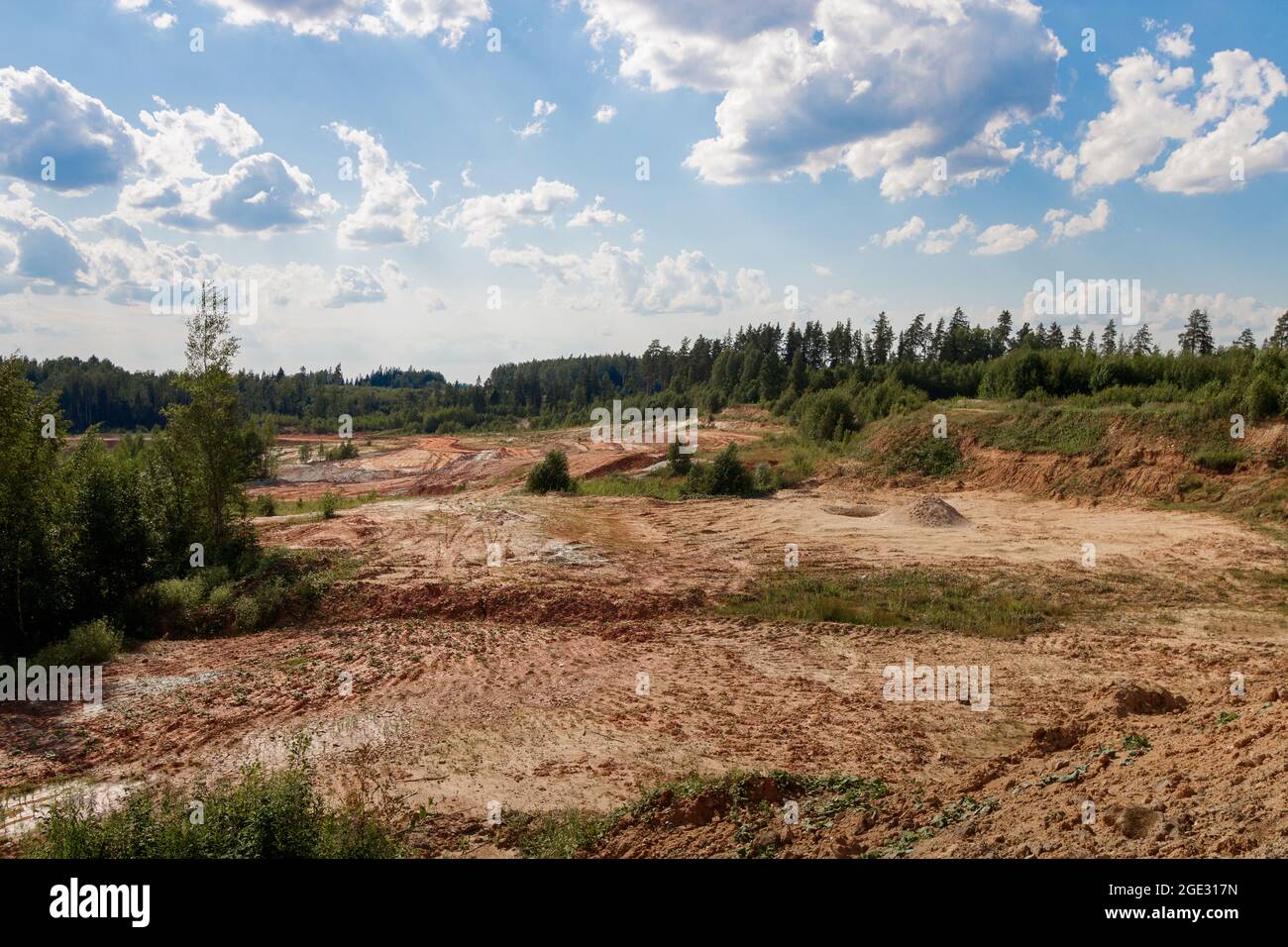 Huge quarry from above. Orange and brown sand. Mountainous and rocky ...