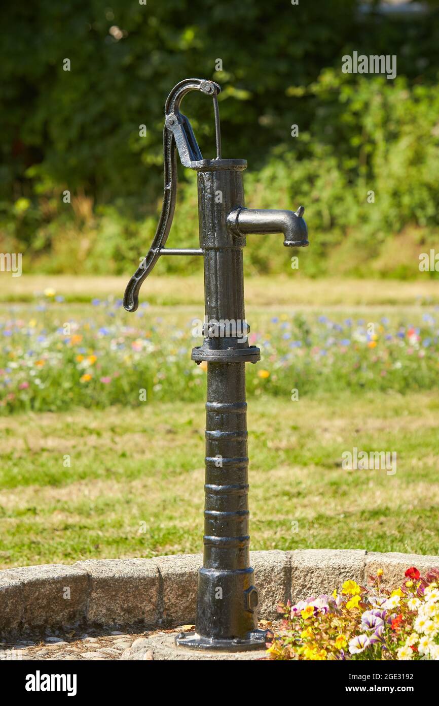 Old green street water pump. Usually the water from such pumps is not ...
