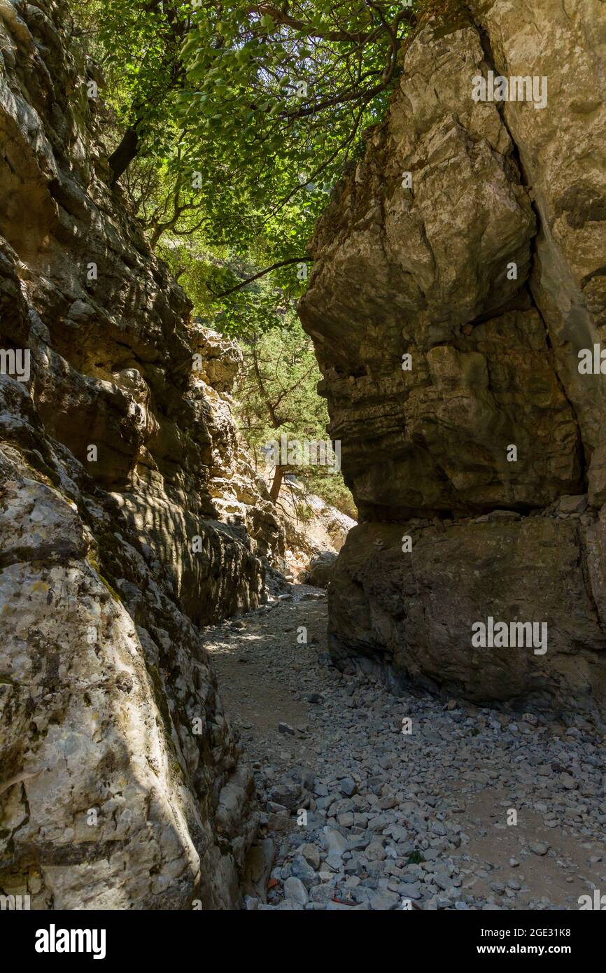 A narrow gorge and dry riverbed in a hot climate (Imbros Gorge, Crete ...