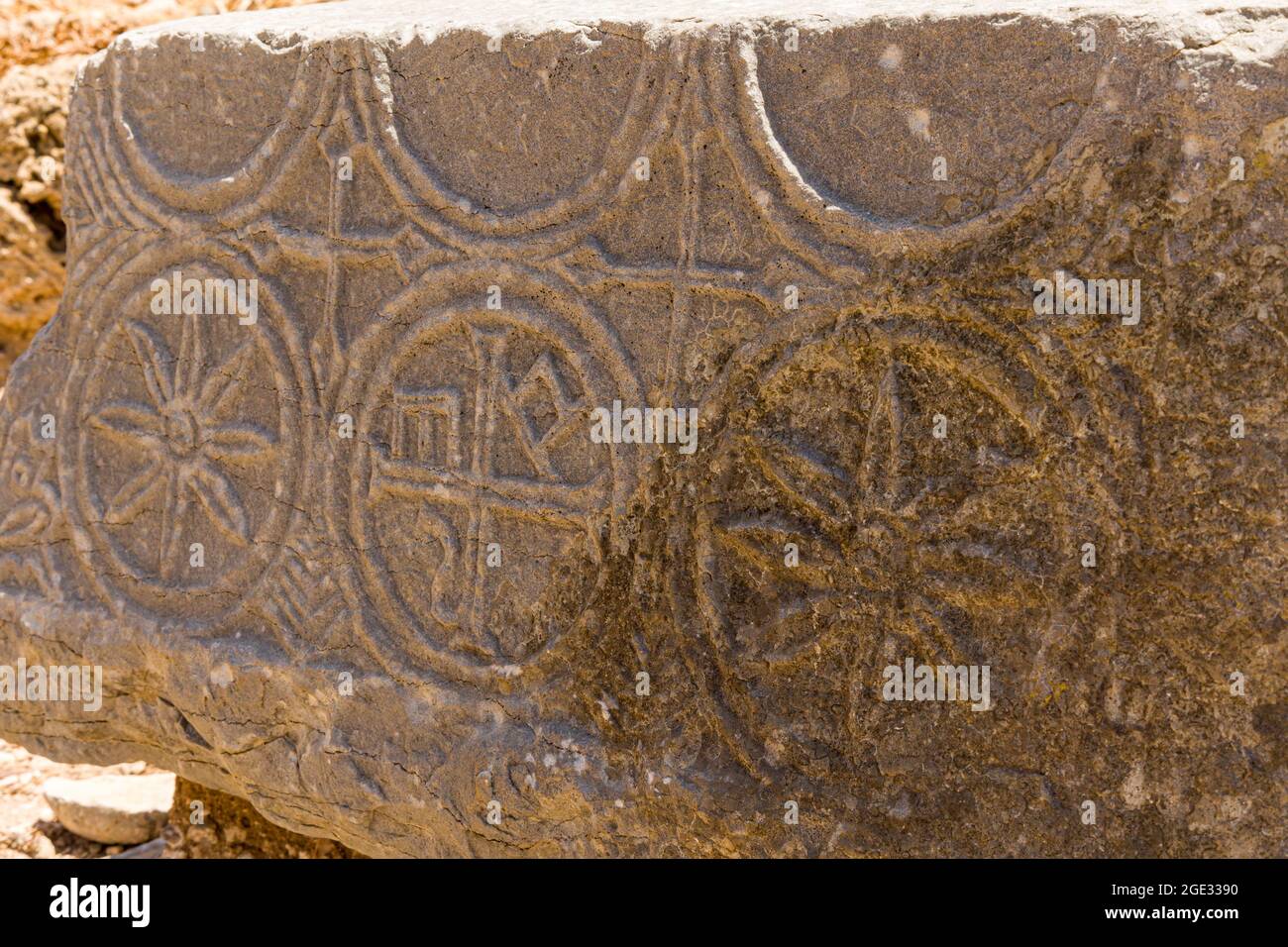Ancient inscriptions on a stone slab at the ruins of Itanos on Crete ...