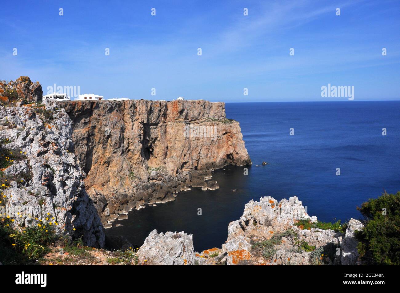 Steep cliffs and blue sea on Menorca, Spain Stock Photo - Alamy