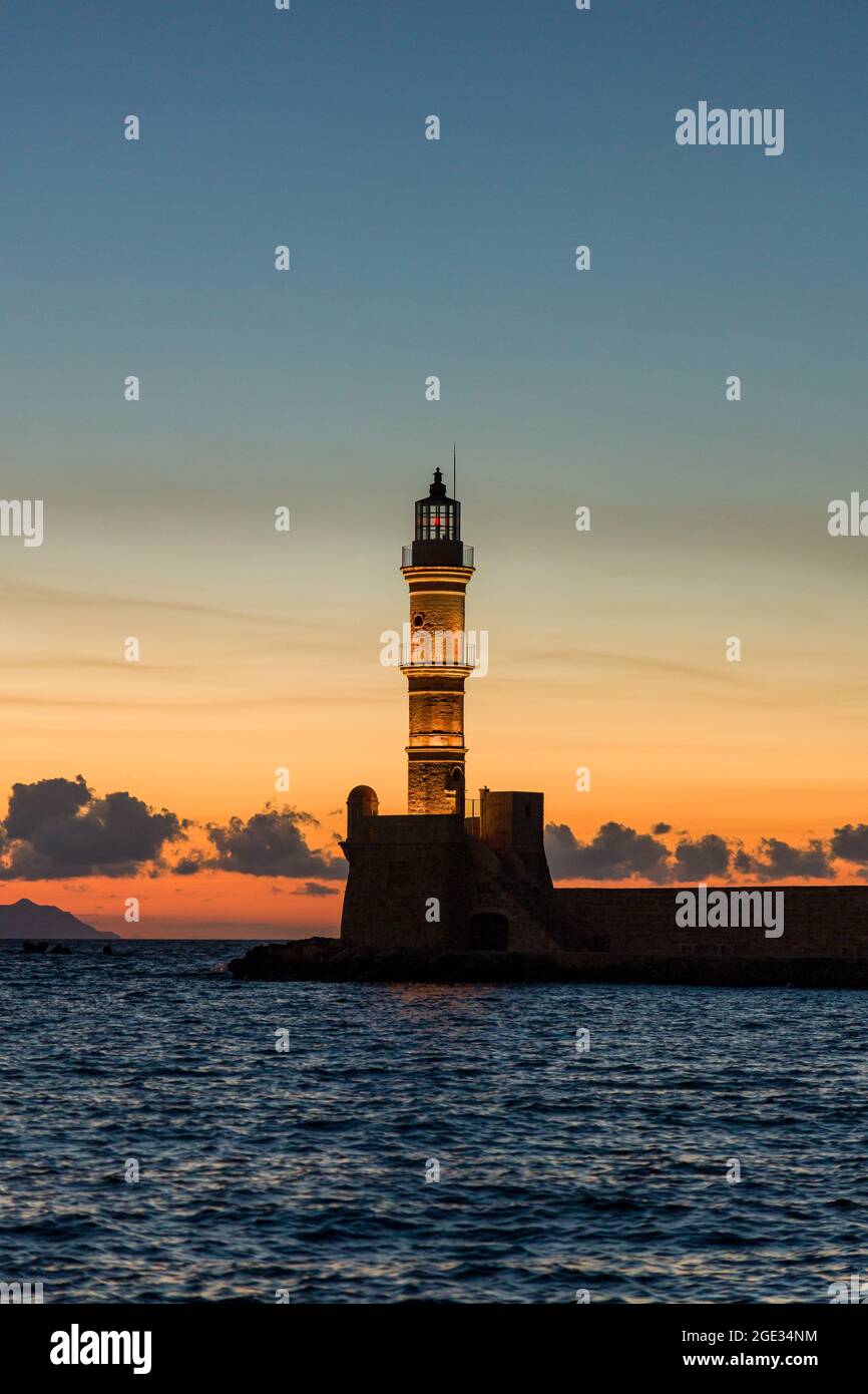 Old lighthouse at the ancient Venetian port of Chania (Greece) at dusk ...