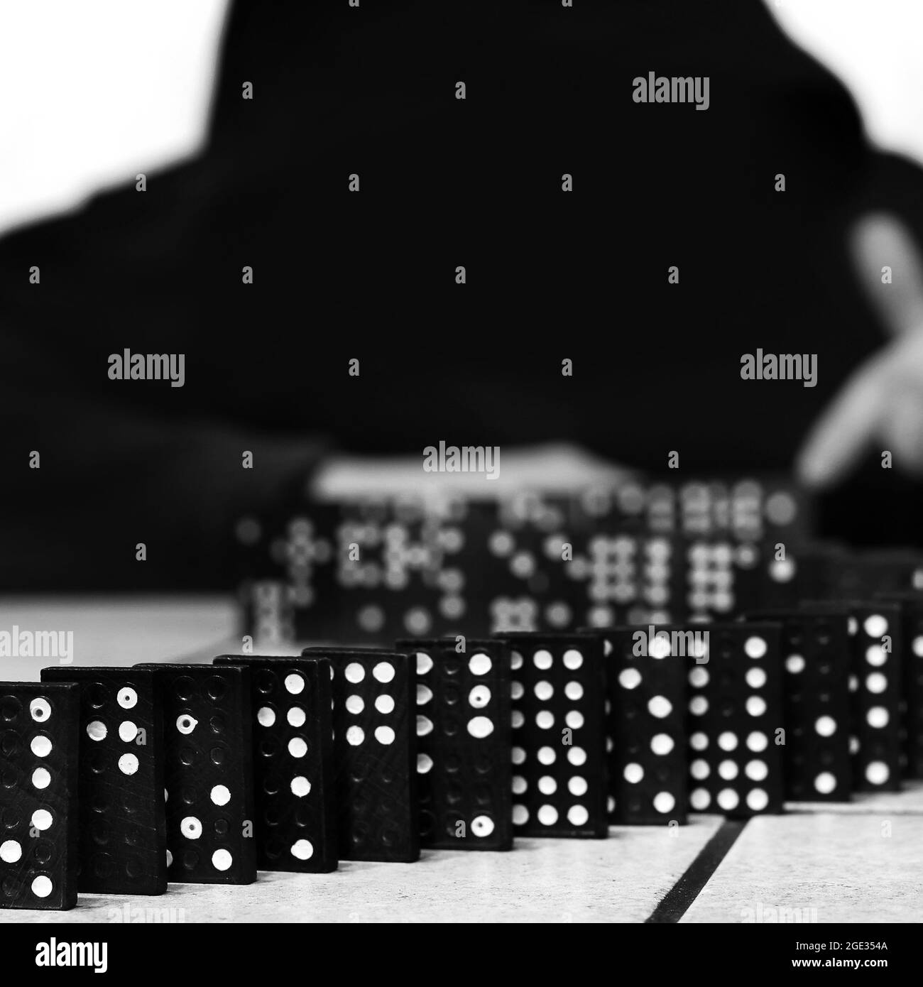 Guy and dominoes hi-res stock photography and images - Alamy
