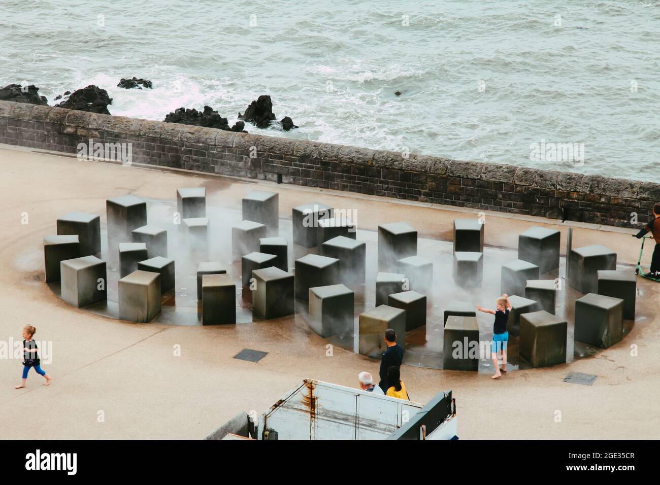 Ammonite Infinity water feature spraying mist on children at the ...