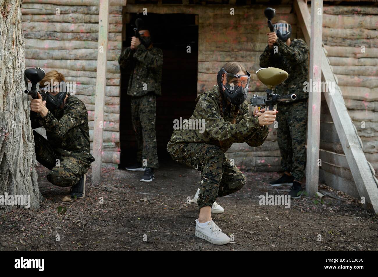 Paintball team fights on playground in the forest Stock Photo - Alamy
