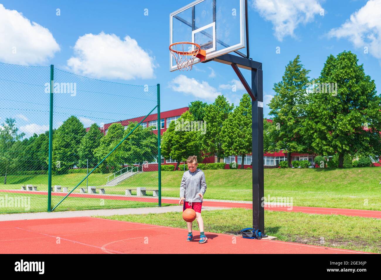 Young 10s boy having fun playing basketball outdoors.nice,cool ...