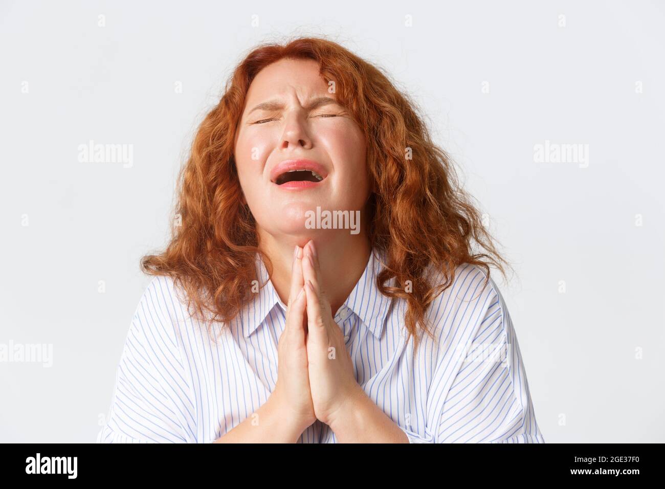 Desperate crying middle-aged woman pleading, begging for help or ...