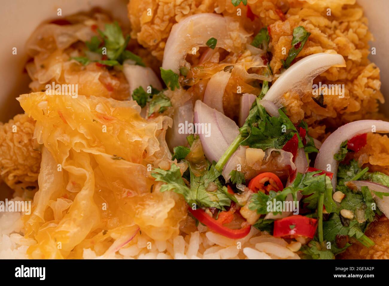 Delicious fried chicken with white rice or stream rice in the bucket ...