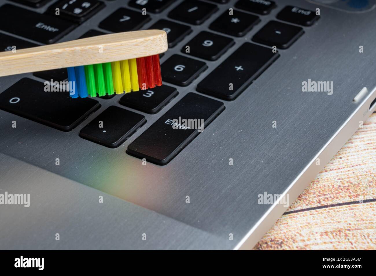 Closeup to colorful of Toothbrush wooden handle Cleaning the keyboard ...