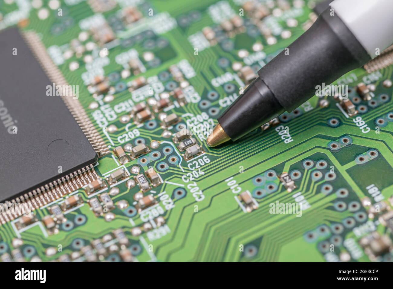 Close-up shot of tiny surface mount / SM capacitor on a section of a ...
