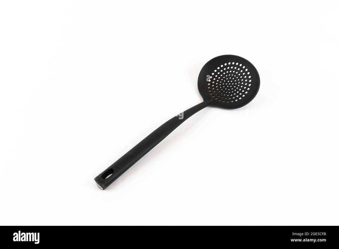 Black plastic skimmer spoon isolated on a white background Stock Photo ...