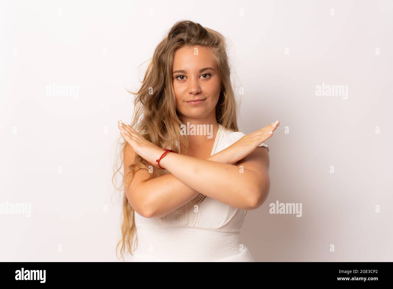 Woman gesturing stop crossed arms hi-res stock photography and images ...
