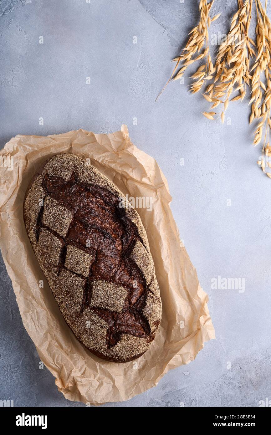 Freshly baked homemade bread on artisan sourdough rye on old light ...