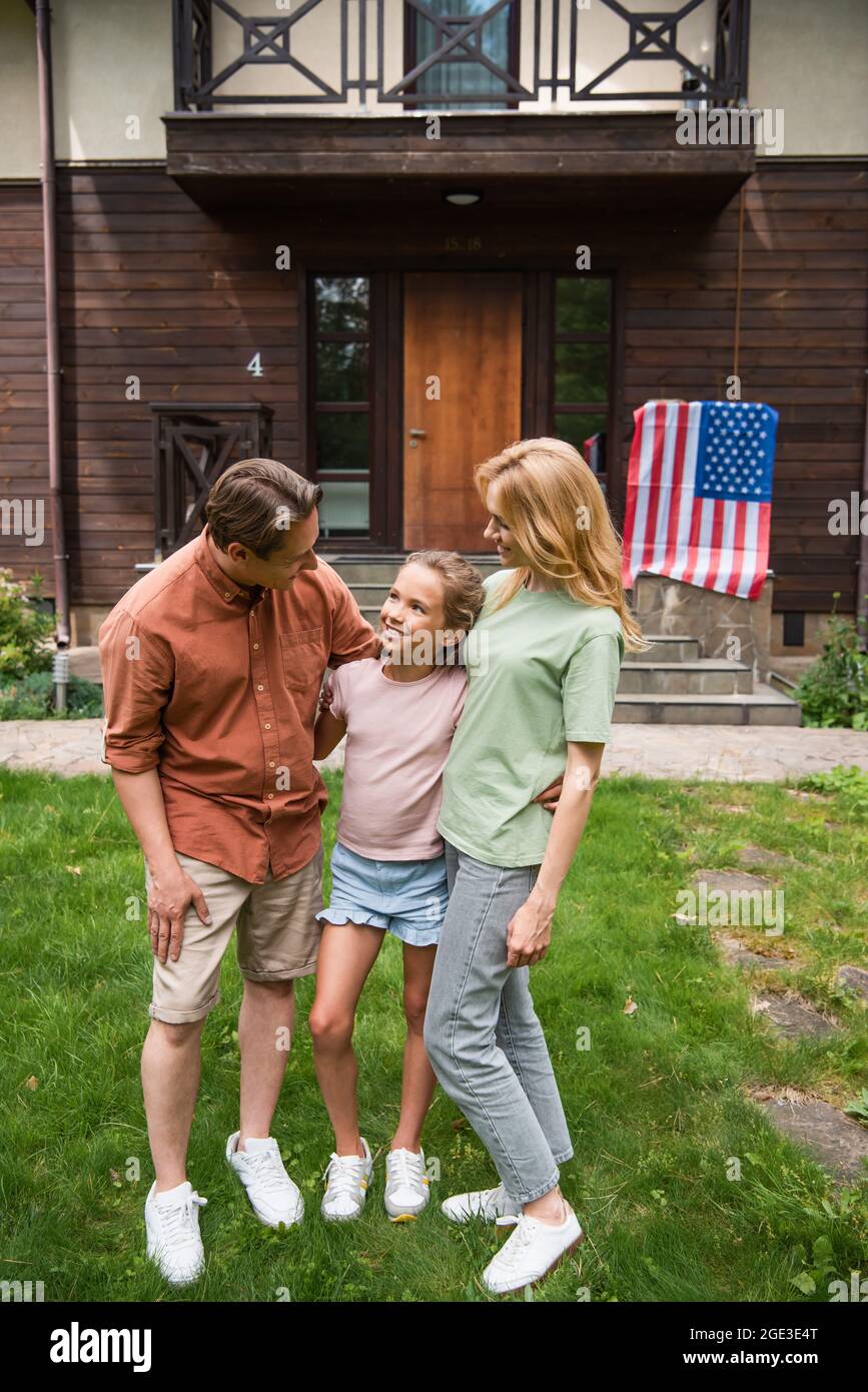Parents hugging daughter hi-res stock photography and images - Alamy