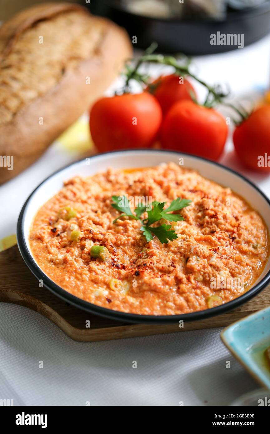 Traditional Turkish breakfast food menemen made by eggs and tomatoes ...