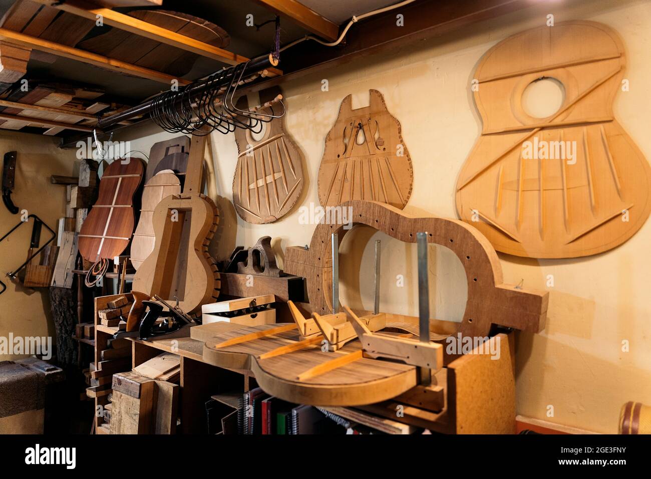 Tools used in the process of making acoustic guitars with wood in a ...